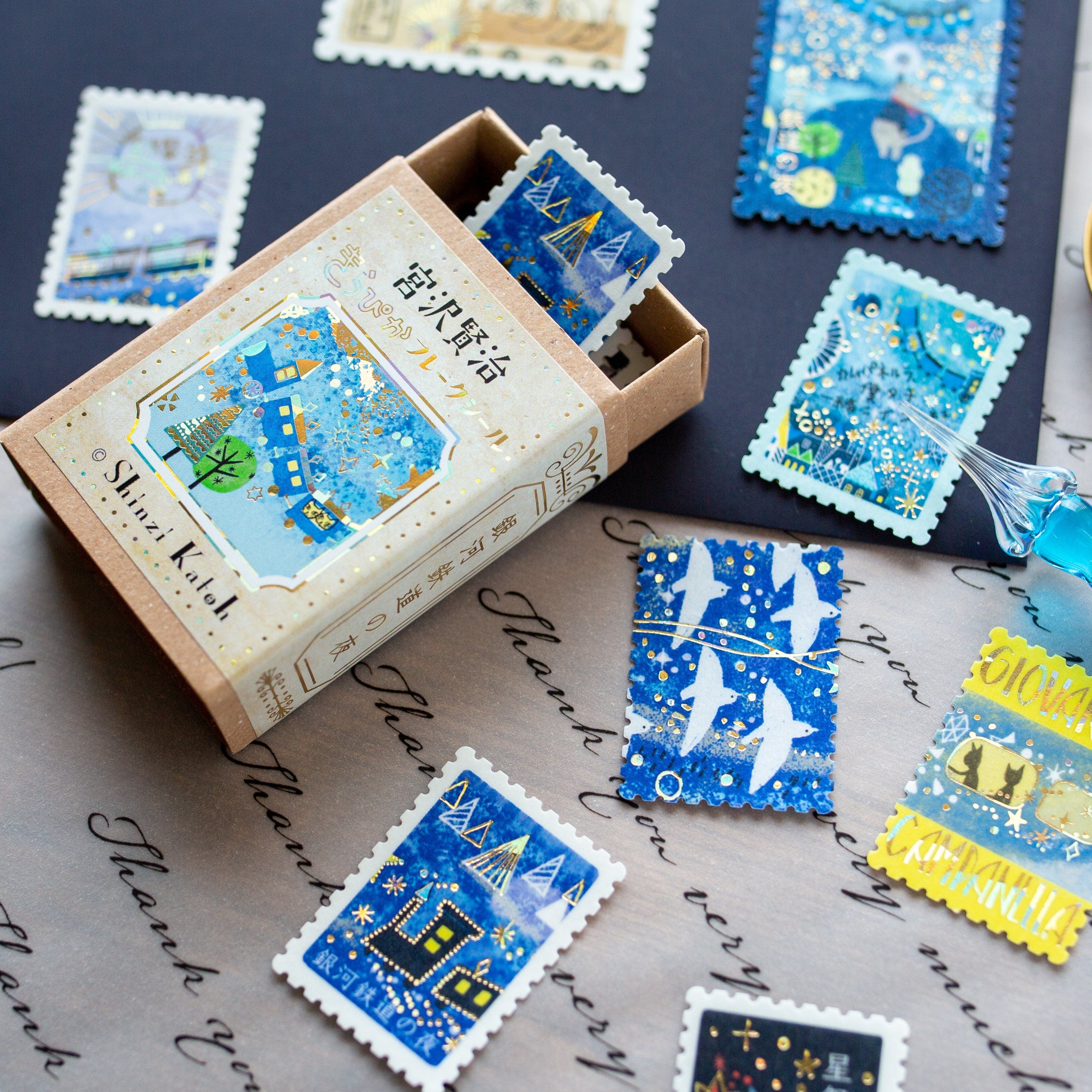 Postage flake stickers in a match box -The Night of the Milky Way Trai ...